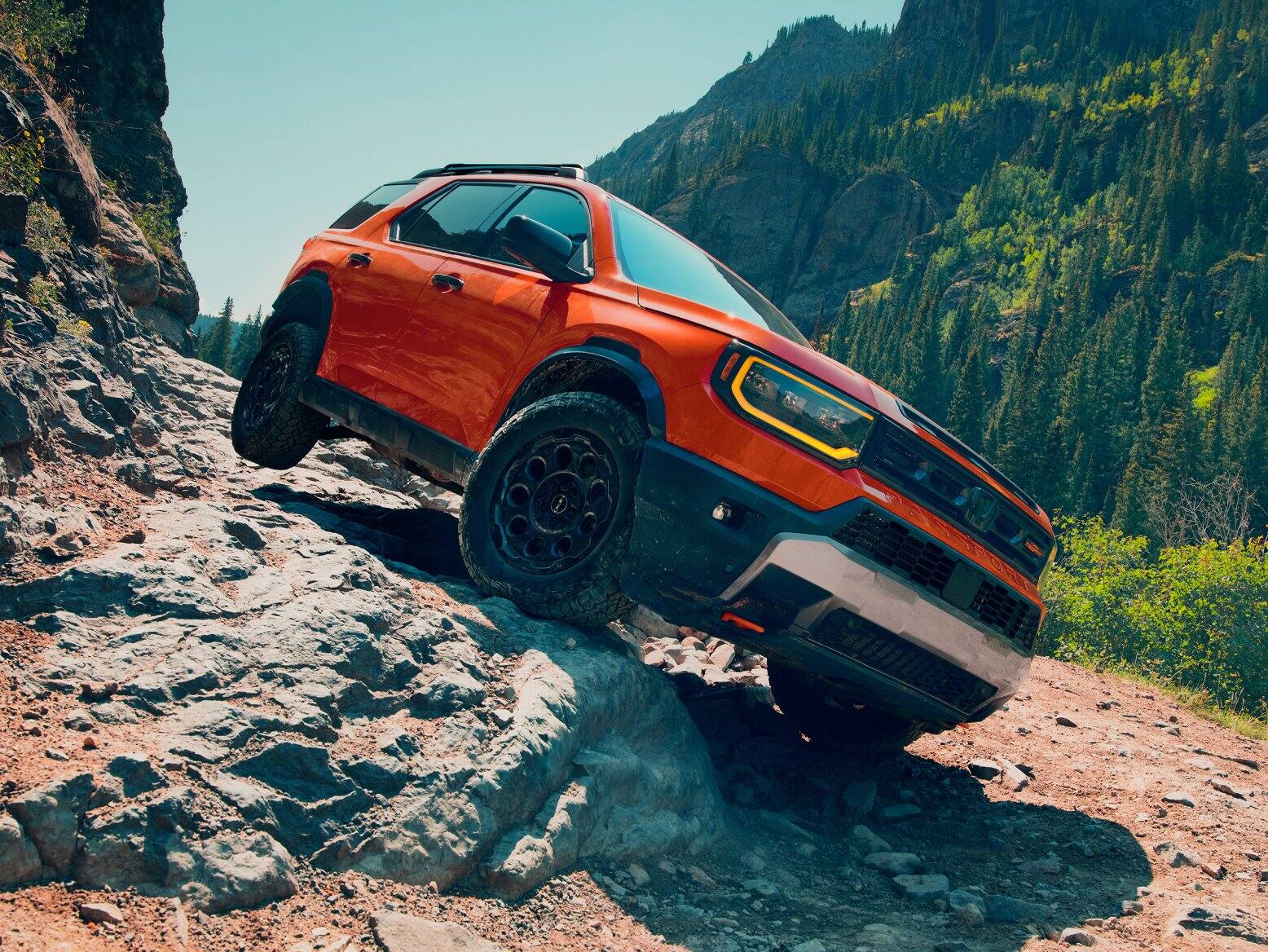 TrailSport Elite shown in Sunset Orange * with Honda Genuine Accessories.